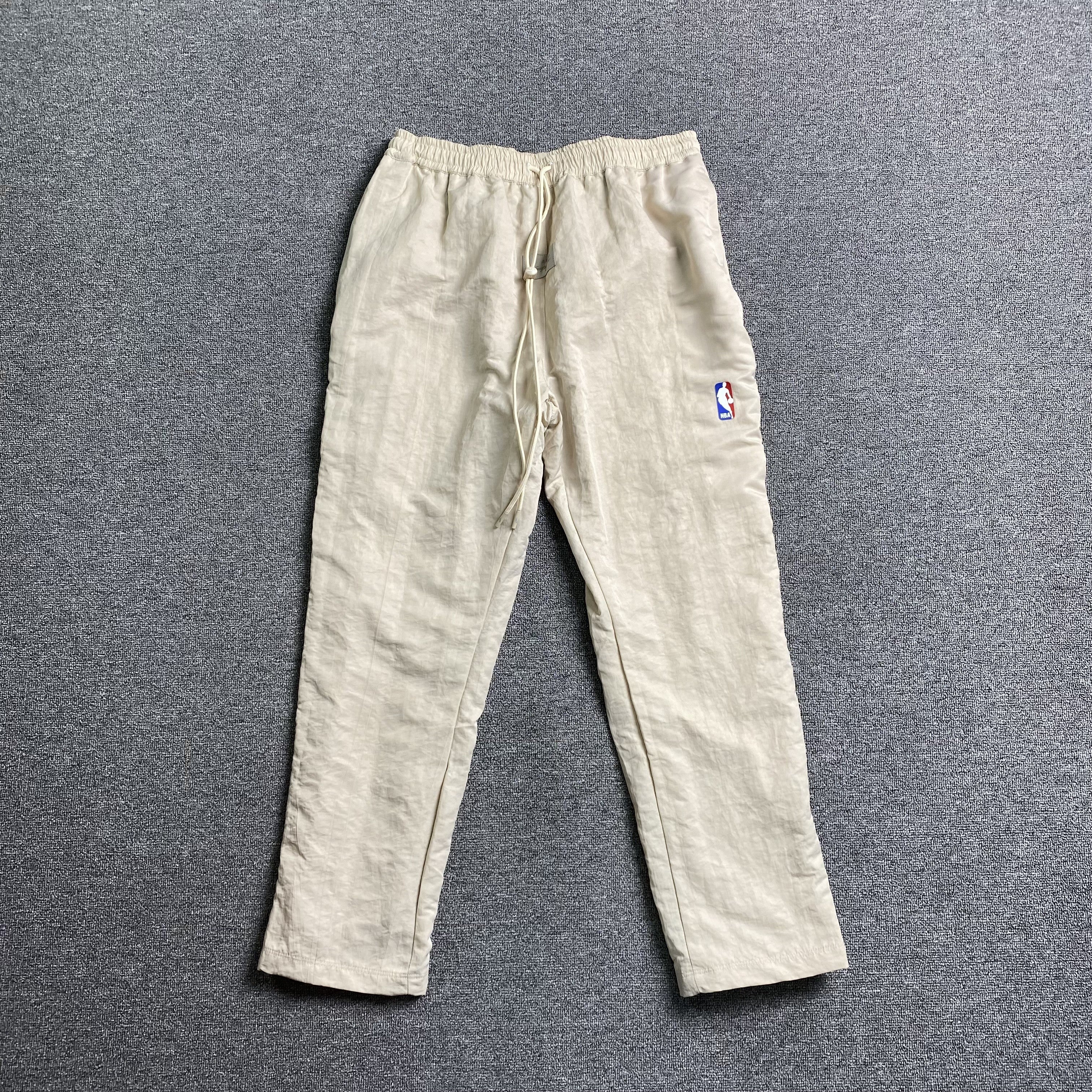Pantalón Fear of God X Nike Nylon Crema - Drip Store Argentina